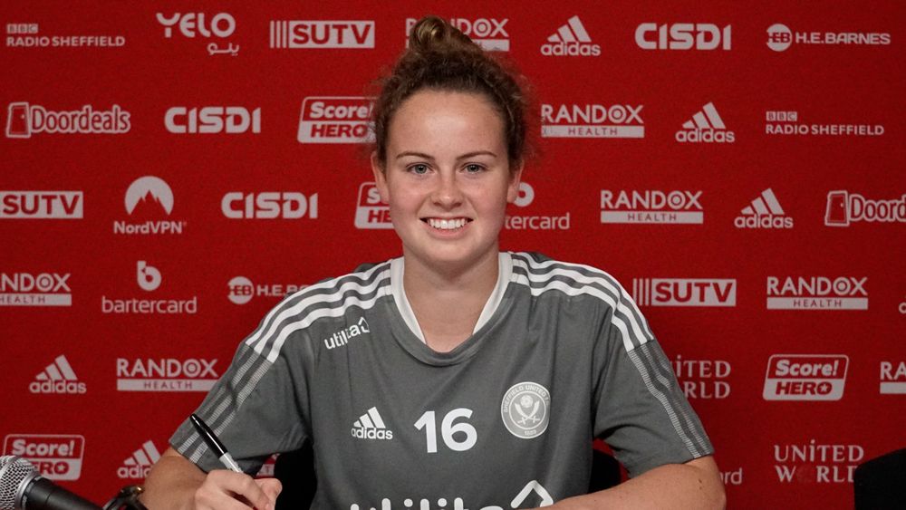 Emily Syme signs
